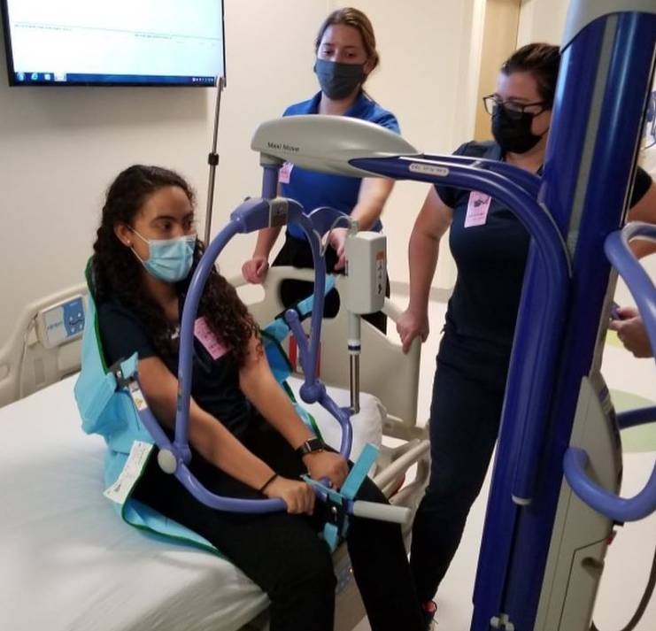 Physical Therapy Students Learn How To Use Lift Equipment